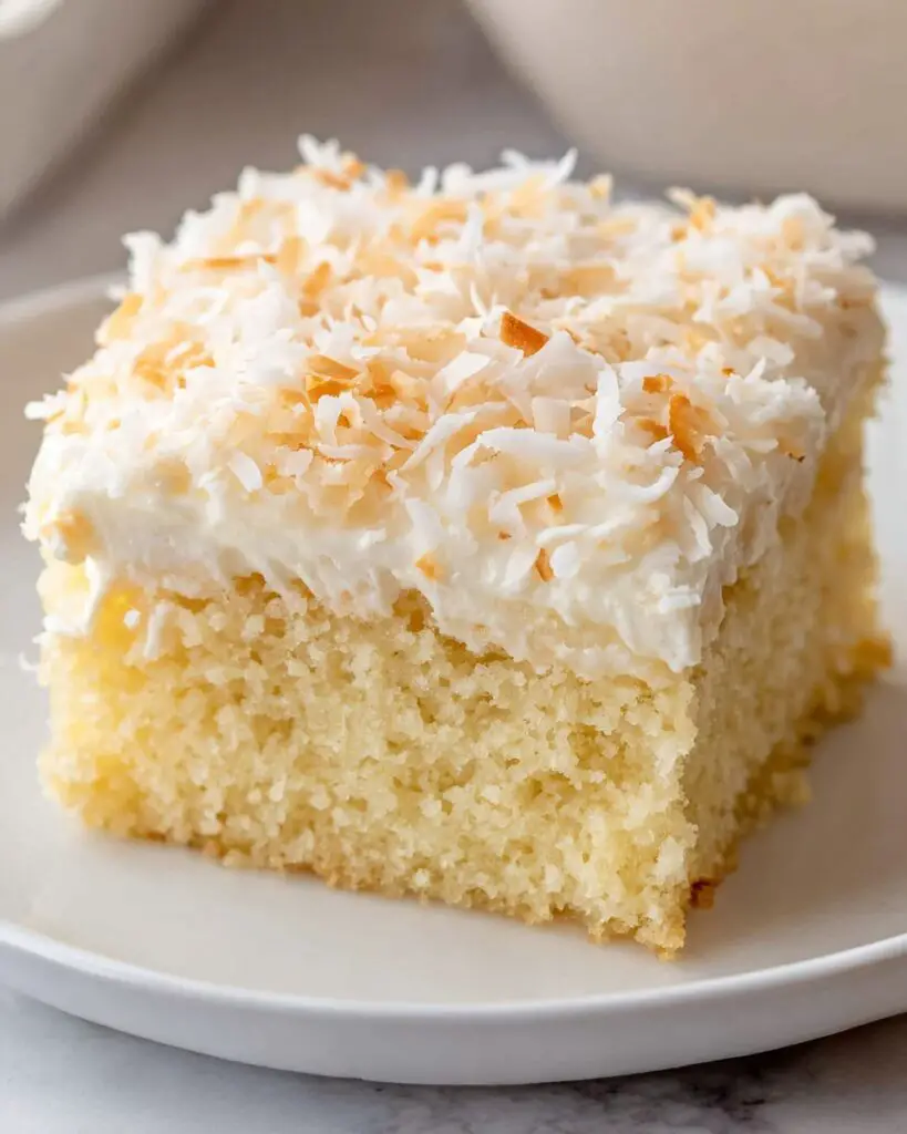 Coconut Pineapple Poke Cake Recipe | Cooked by Sarah